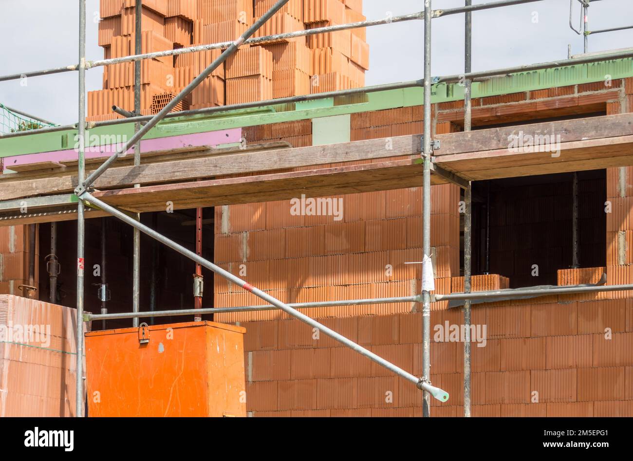 Shell construction of a house with scaffolding Stock Photo - Alamy