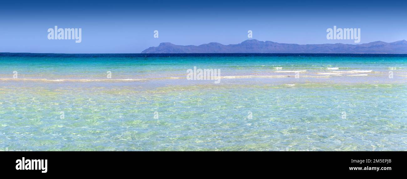 The sea beach of Playa del Port de Pollensa, Mallorca is famous for its ...
