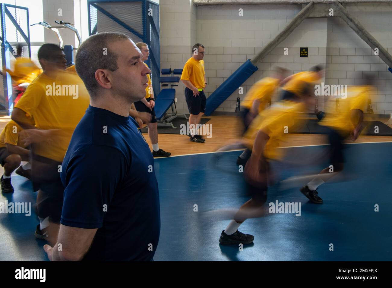 Recruits perform a warm-up run during a physical training session ...
