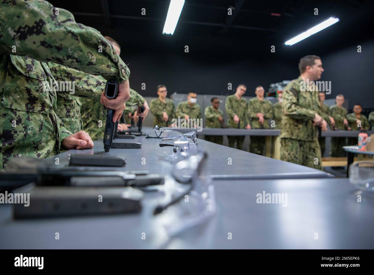 Recruits recieve weapons familiarization training at the Small Arms ...