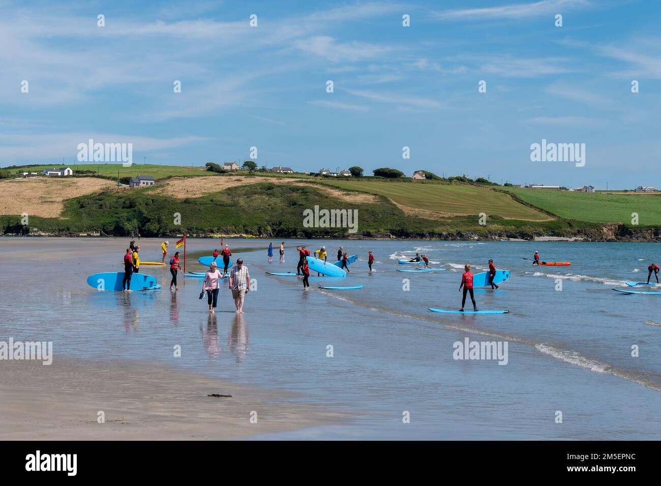 County Cork, Ireland, August 6, 2022. Young people are surfing. A surf ...