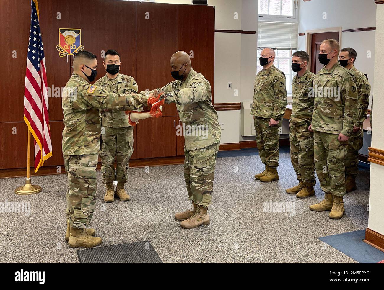 Lt. Col. Juan Villatoro, left, and Sgt. Maj. Beethoven Jacques case the ...