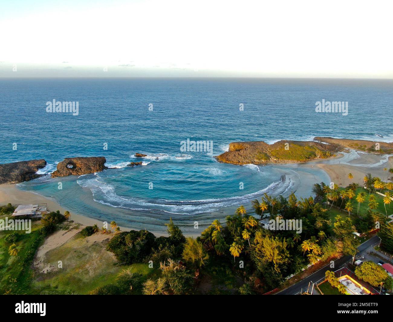 An aerial view of the Playa La Poza del Obispo in Arecibo, Puerto Rico ...