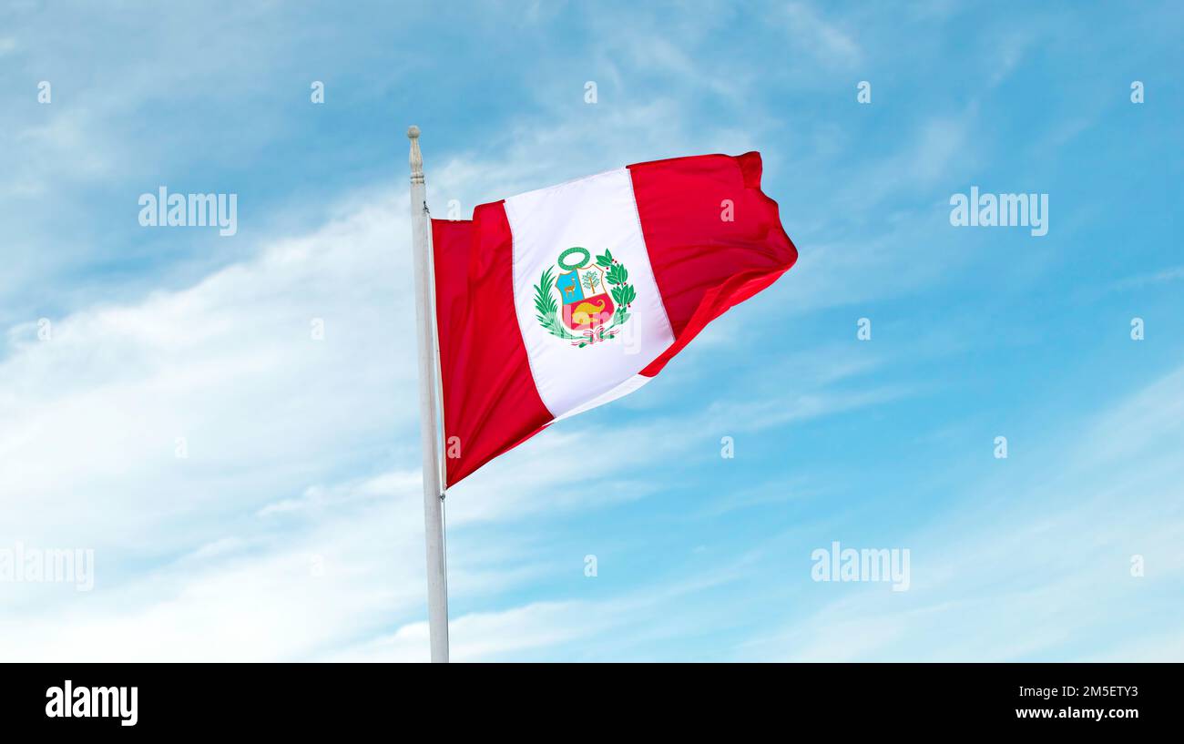 beautiful peruvian flag waving in the blue sky Stock Photo - Alamy