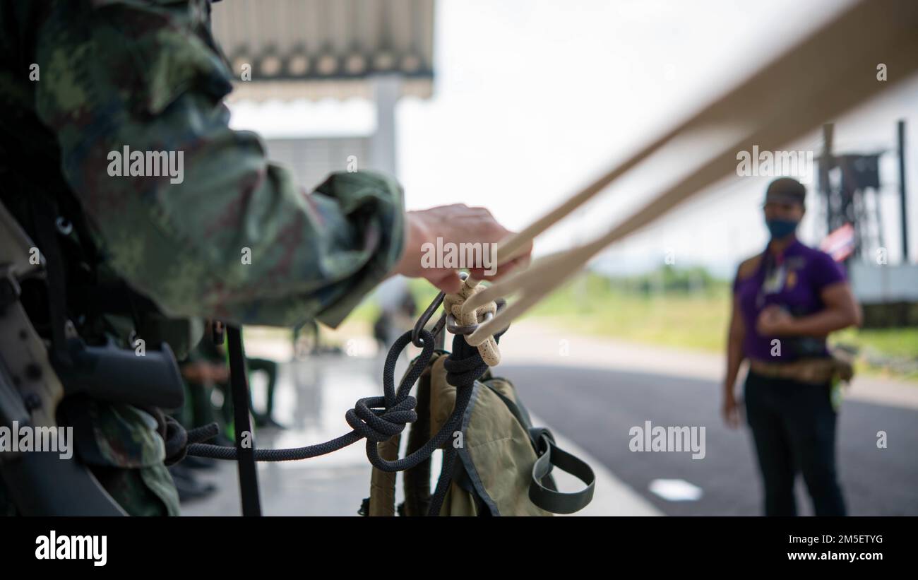 A Royal Thai Army soldier demonstrates how to secure an infantry load ...