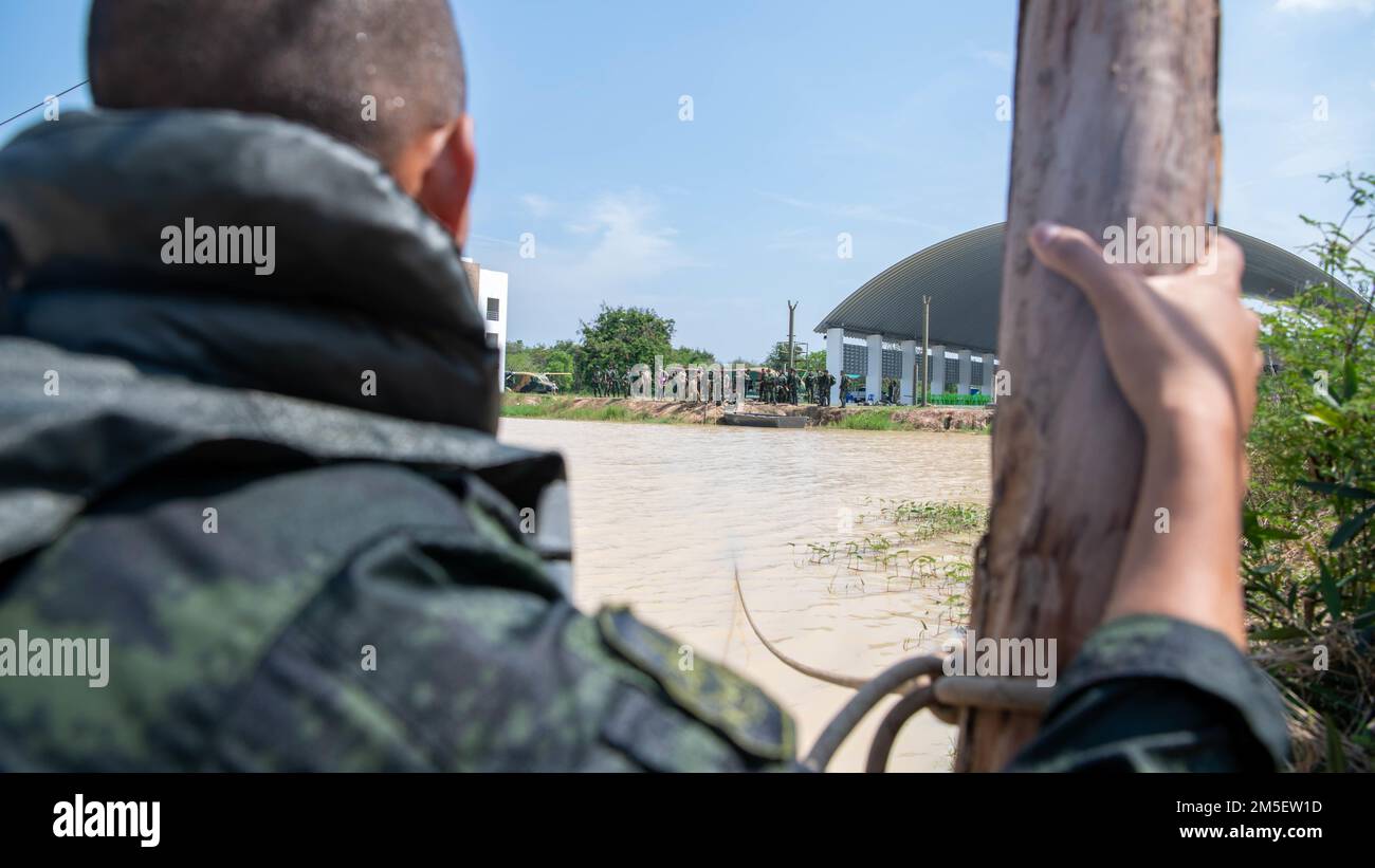 A Royal Thai Army soldier waits on his squad to finish securing a one ...