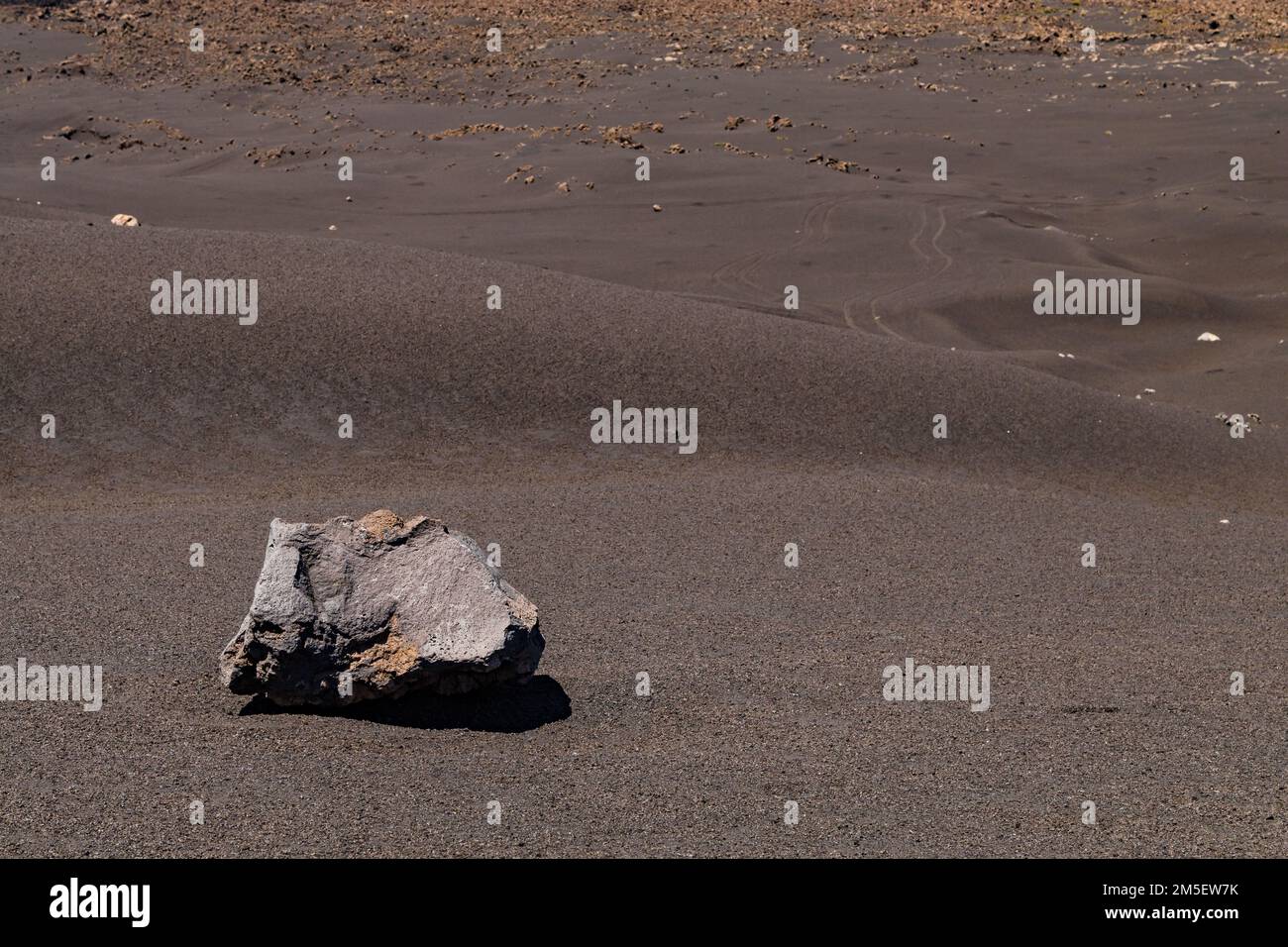 Slope with lava, ash and a large boulder at the volcano Pico do Fogo on ...