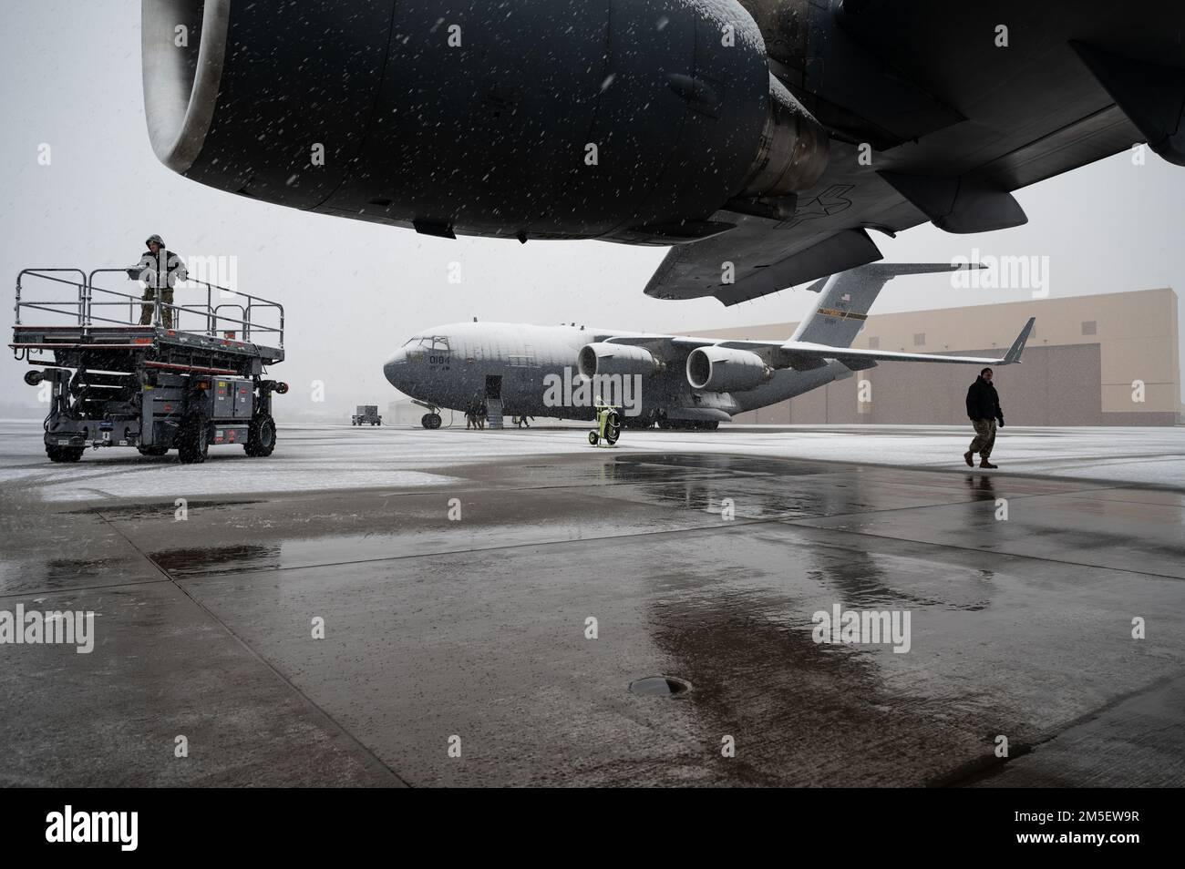 Airmen assigned to the 911th Aircraft Maintenance Squadron prepare a C ...