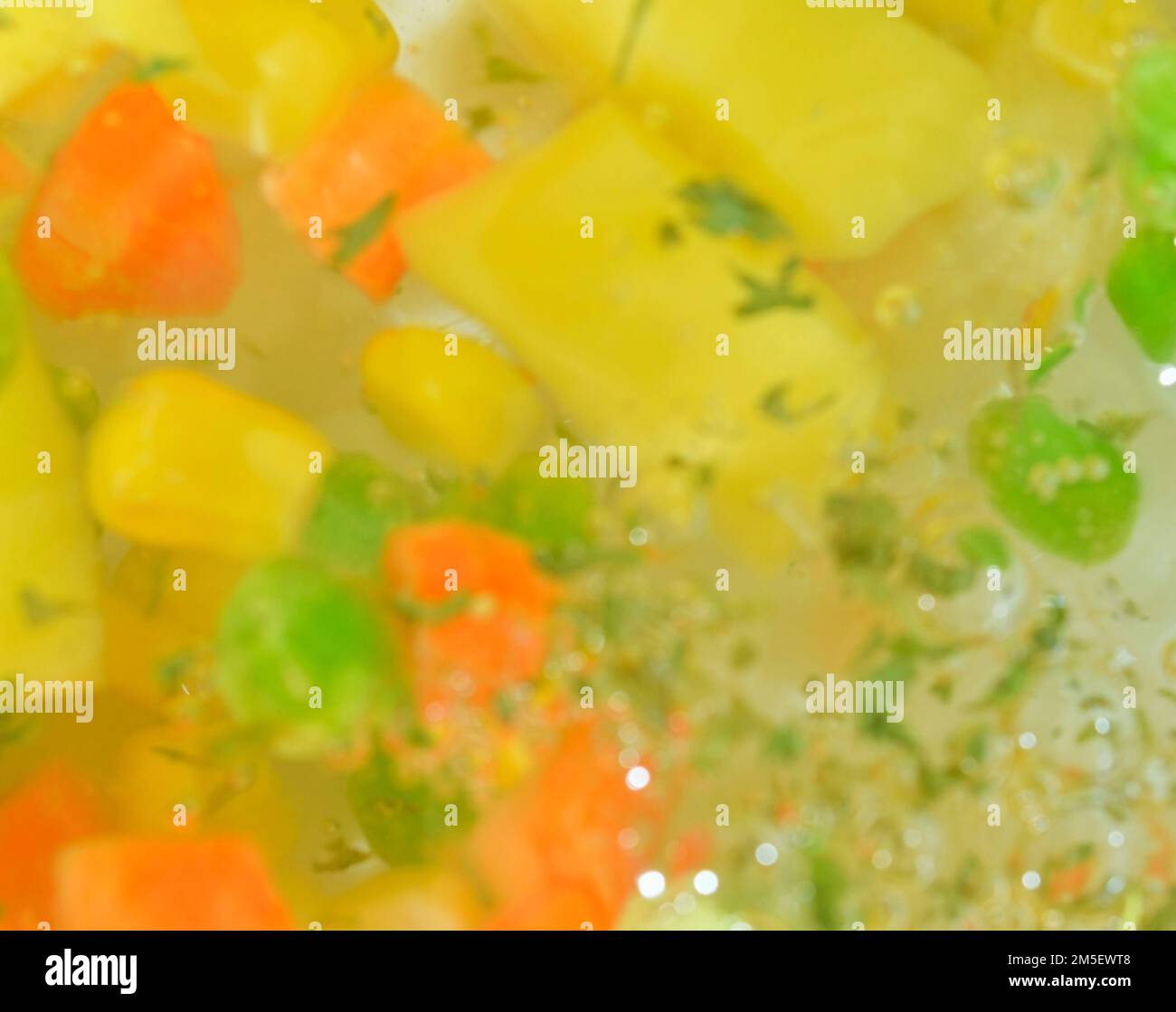 Boiling water with fresh vegetables, close-up. Close-up view of the ...