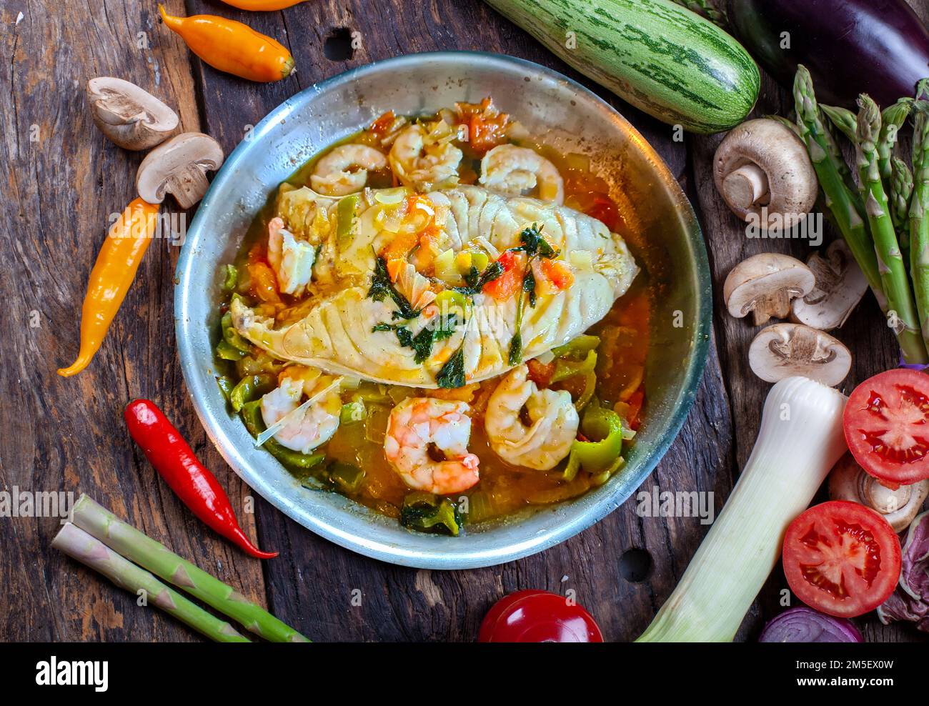 Moqueca, a traditional Brazilian dish with badejo fish and large shrimp ...