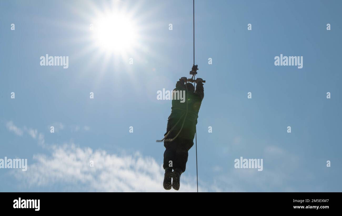 A soldier travels on a zip-line as part of a confidence course on the ...
