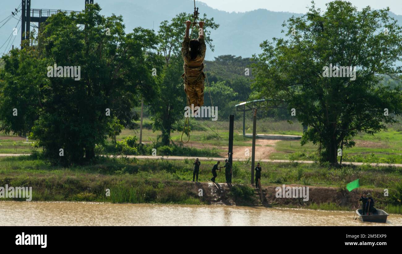 A Royal Thai Soldier waves a signal flag as a Soldier from Alpha ...