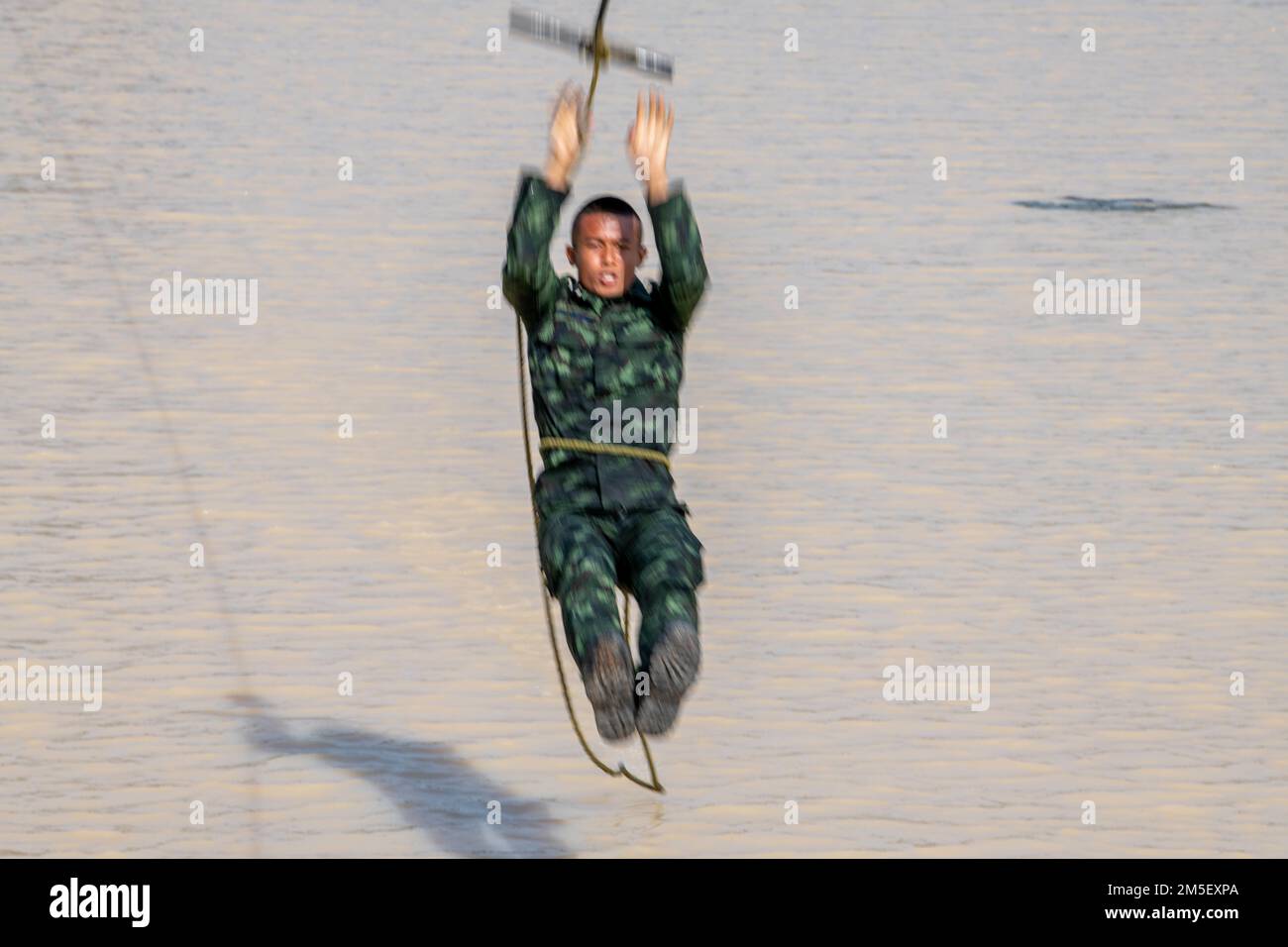A Royal Thai Soldier releases the zip-line at the end of a confidence ...