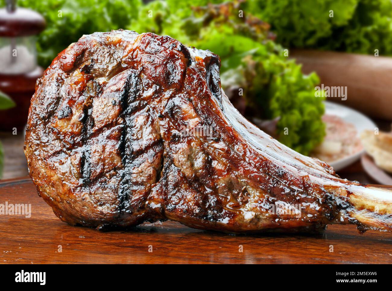 freshly grilled Tomahawk steaks Stock Photo - Alamy