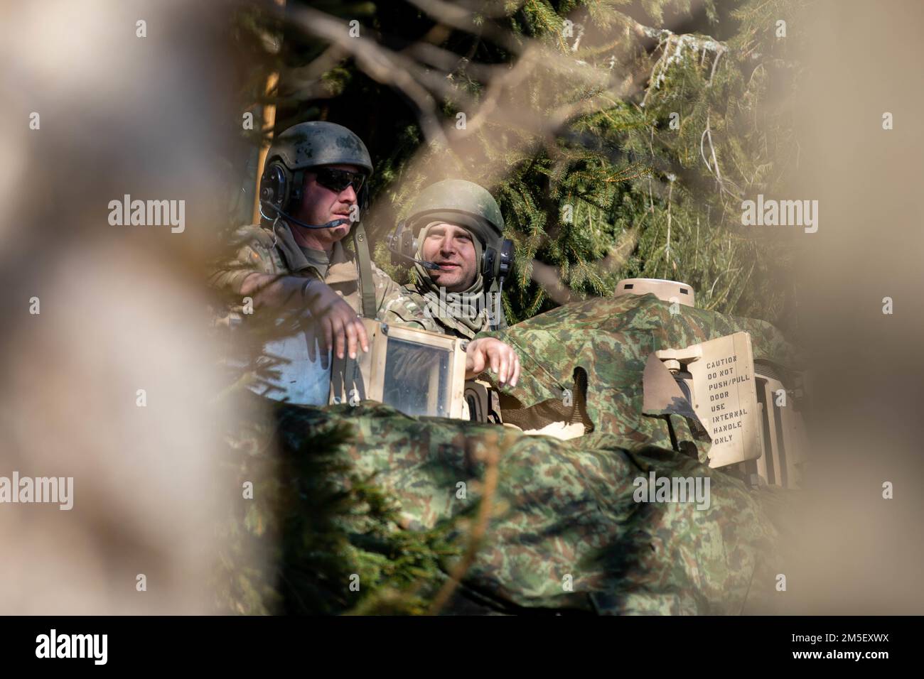 U.S. Army Staff Sgt. Dustin Herd and Sgt. Christopher Widner, assigned ...