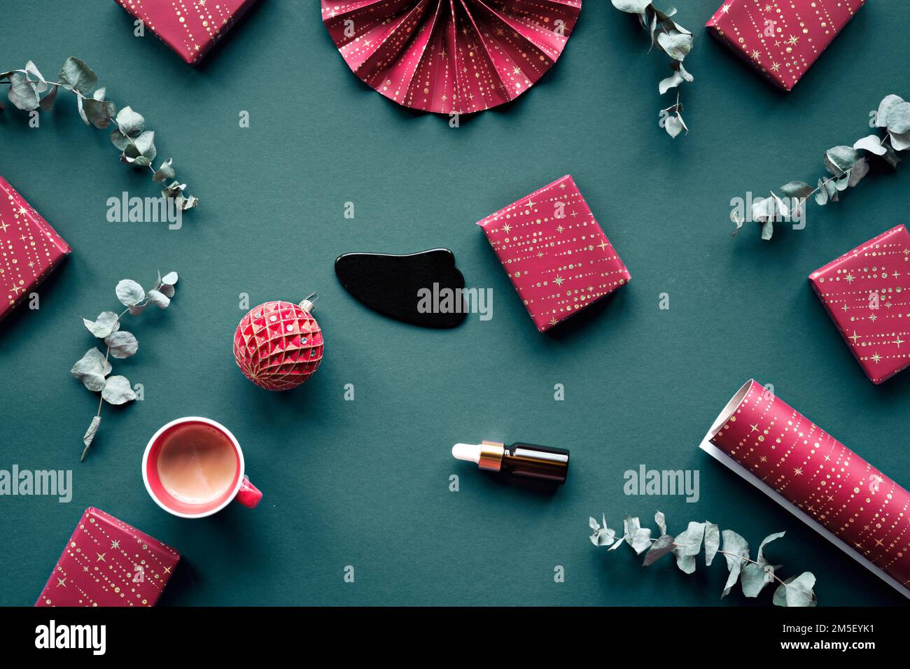 Christmas gift boxes, flat lay in green and viva magenta dark burgundy ...