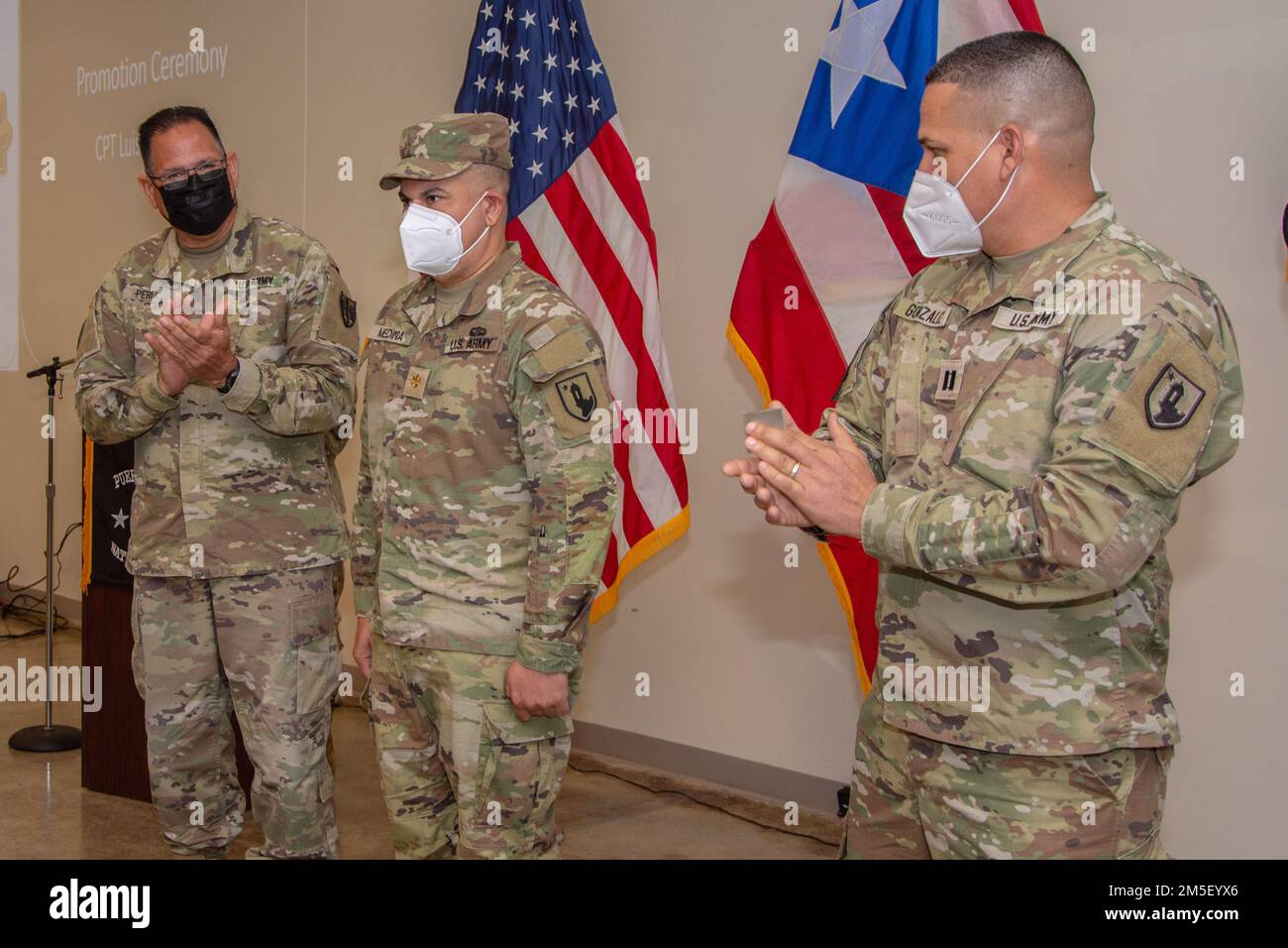 Col. Víctor Pérez (left), and Cpt. Angel Gonzalez give an ovation to ...