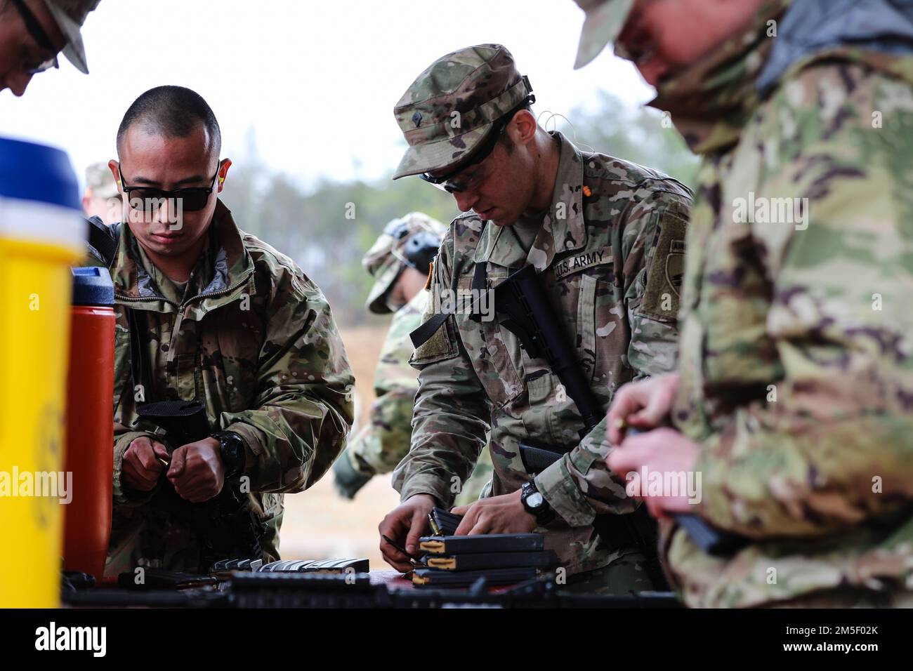 U.S. Army Reserve Soldiers load ammunition before an M4 carbine ...