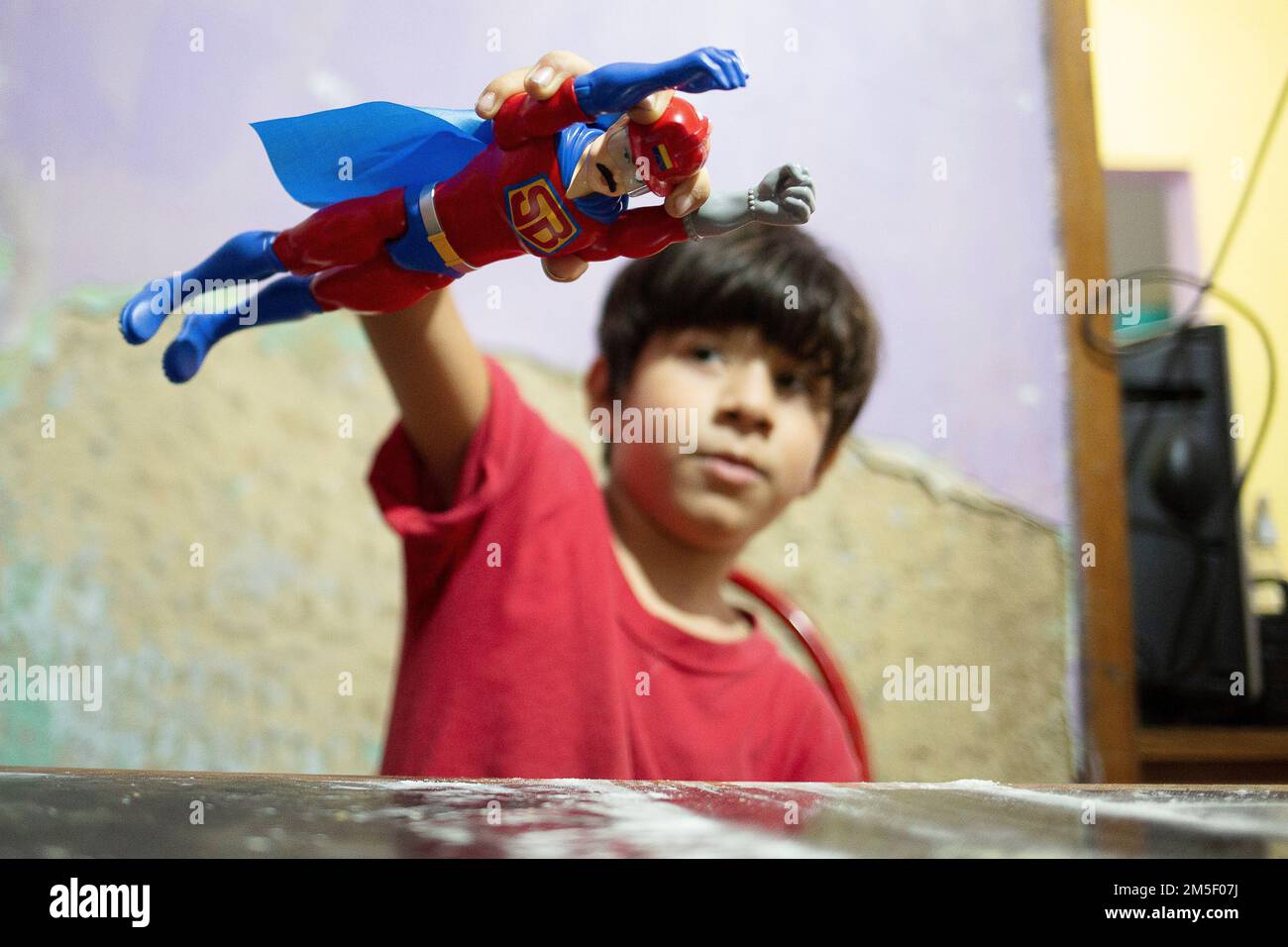 Caracas, Venezuela. 26th Dec, 2022. A child plays with "Super Mustache ...