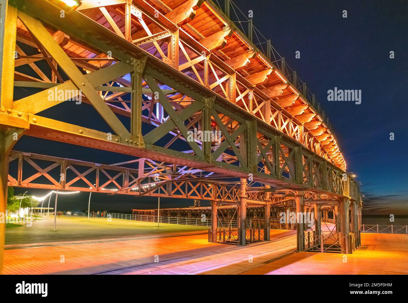 Mining pier known as the Tinto Dock "Muelle del Tinto" at night . This ...