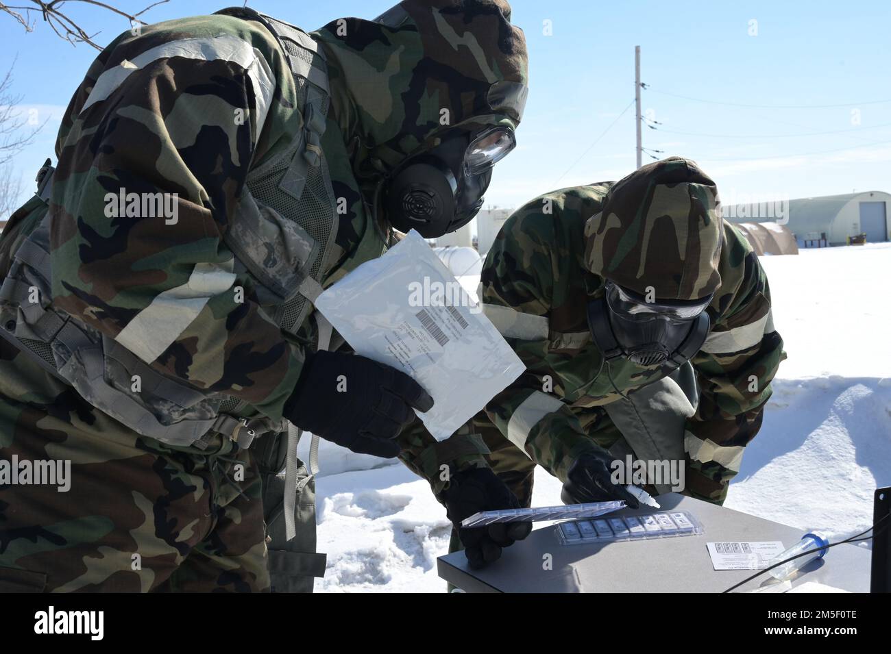 U.S. Air Force emergency management members Senior Master Sgt. Jeremy ...