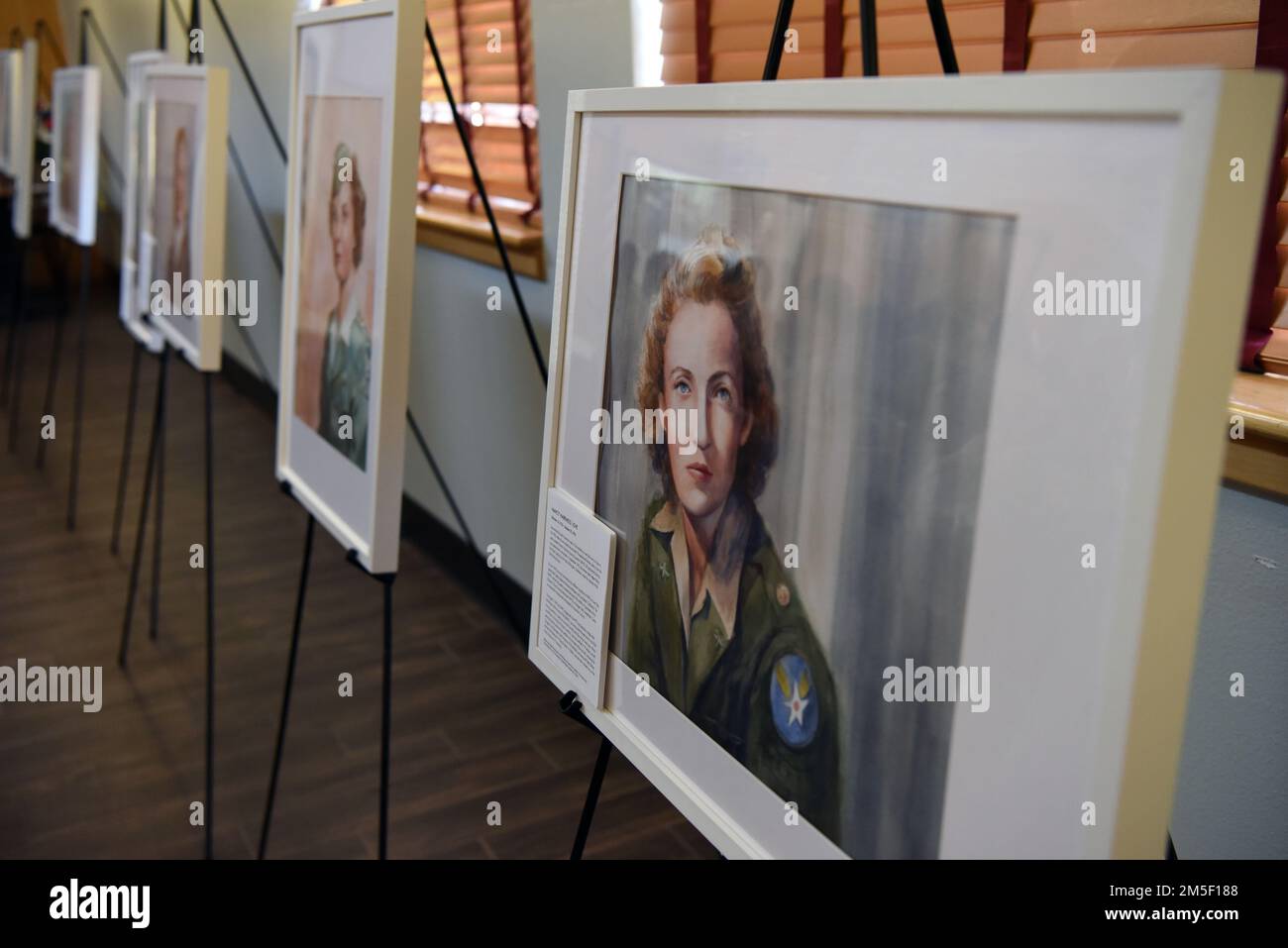 Portraits of historically recognized female pilots line the room of the ...