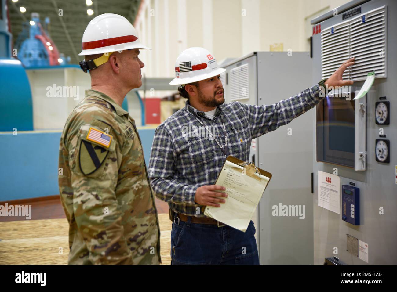 Daniel Kranz, Electrical Engineer, shows Col. Van Epps, NWD Commander ...