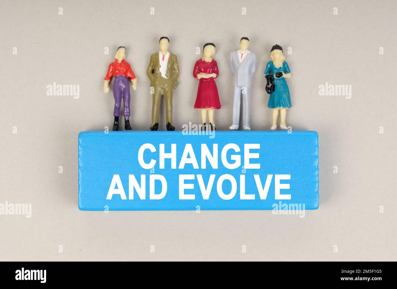 Business concept. On the blue block the inscription - Change and evolve ...
