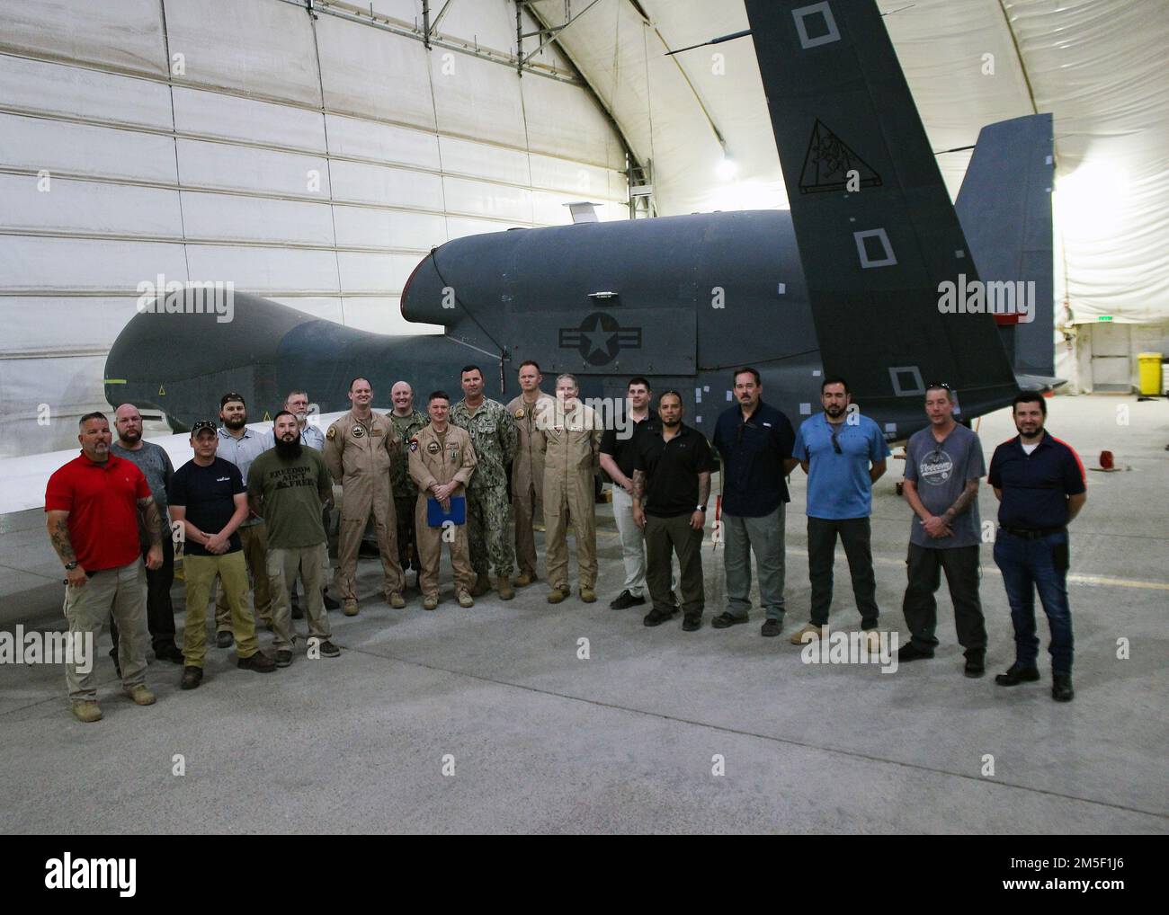U.S. Navy personnel from Task Force 57 pause for a group photo at Al ...