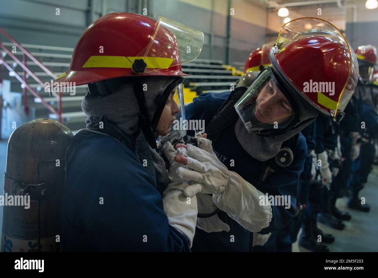 Recruits don firefighting equipment before a firefighting and damage ... Recruits don firefighting equipment before a firefighting and damage ...