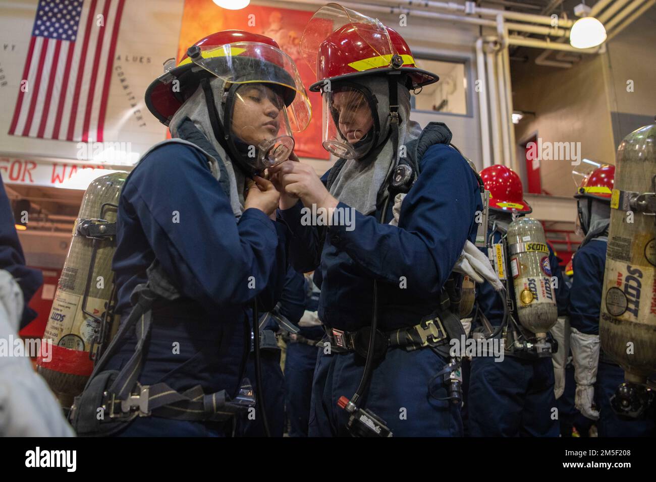 Recruits don firefighting equipment before a firefighting and damage ... Recruits don firefighting equipment before a firefighting and damage ...