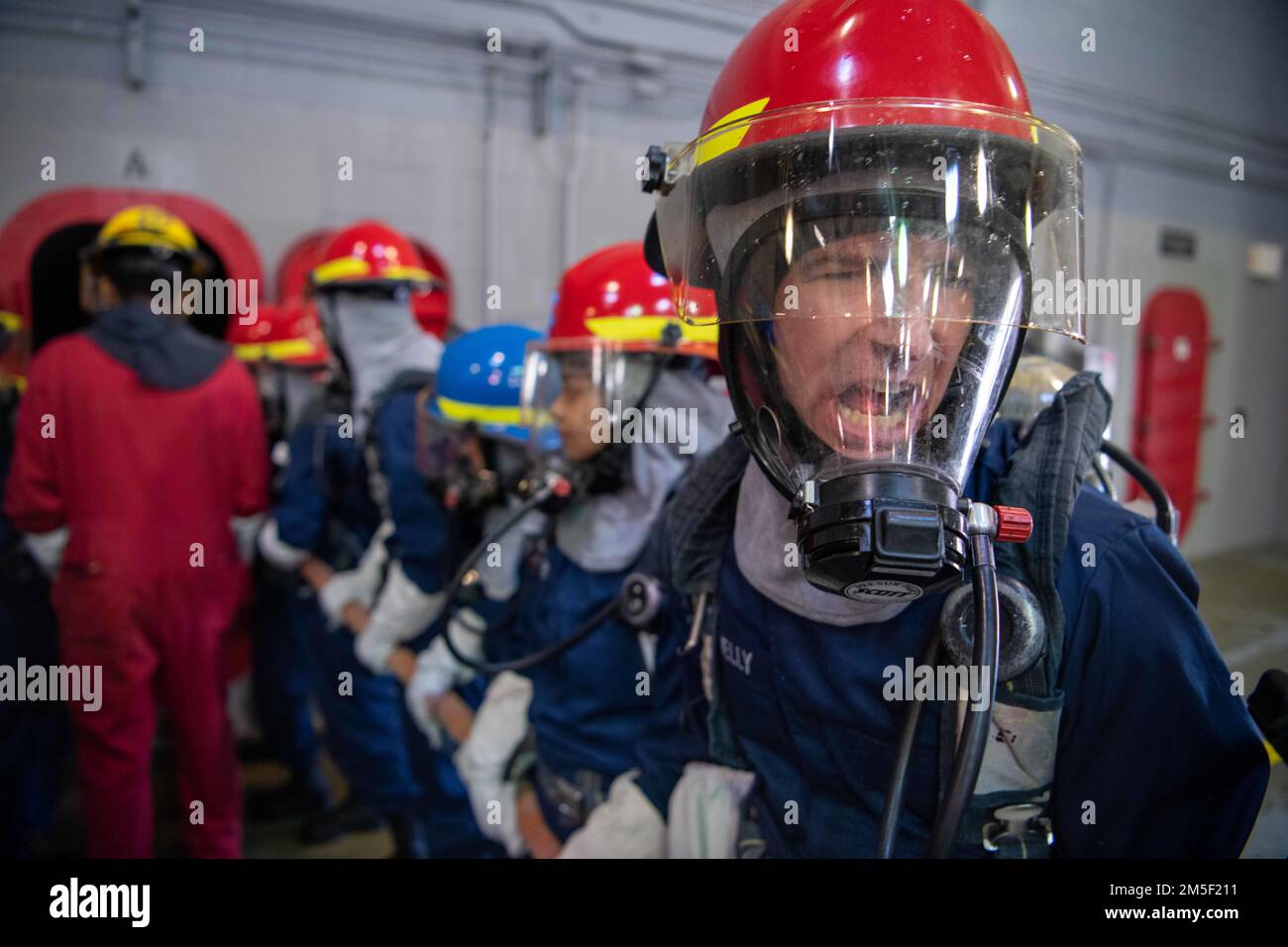 Recruits communicate during a firefighting training exercise inside the ...