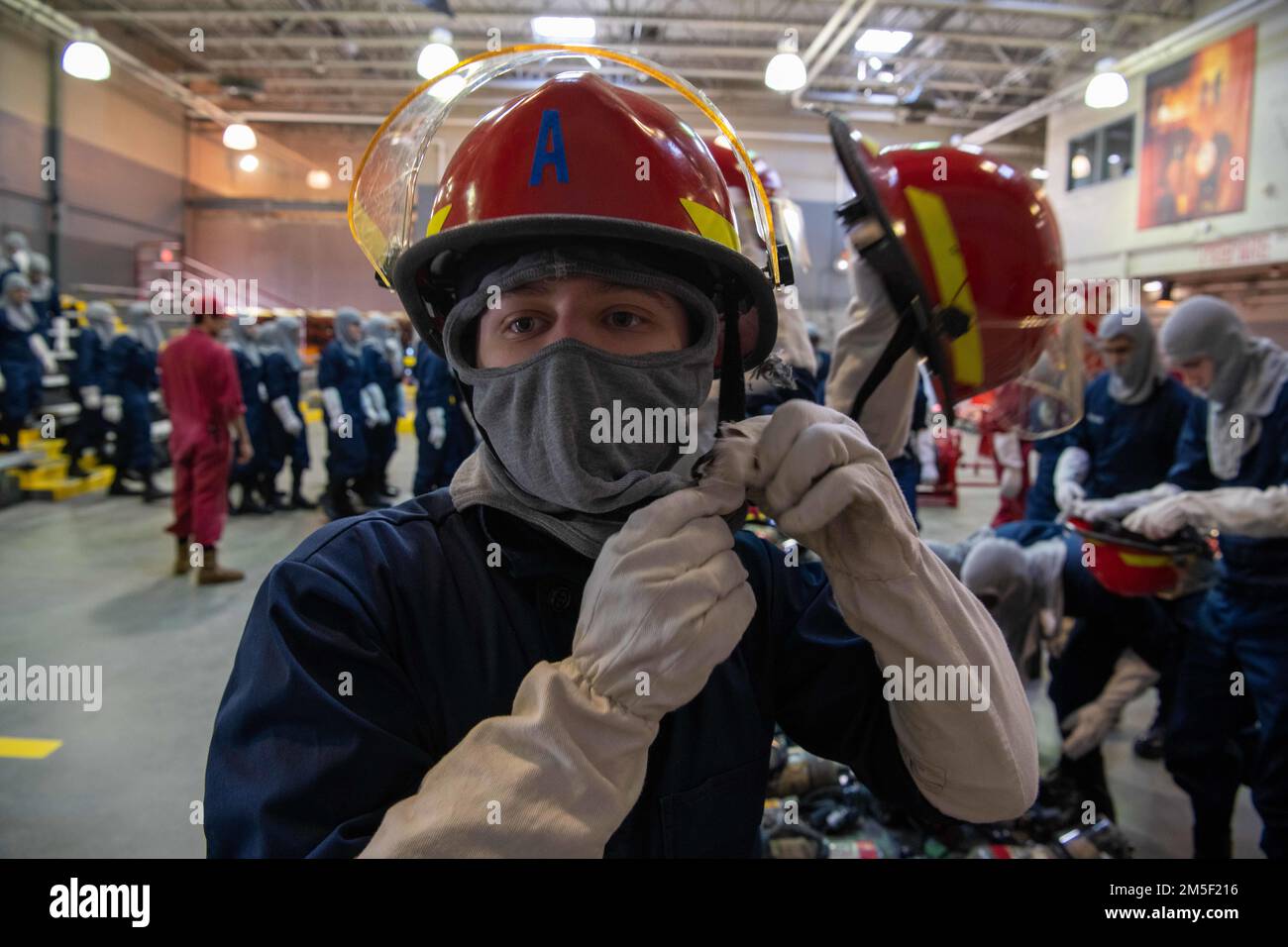 Recruits don firefighting equipment before a firefighting and damage ... Recruits don firefighting equipment before a firefighting and damage ...