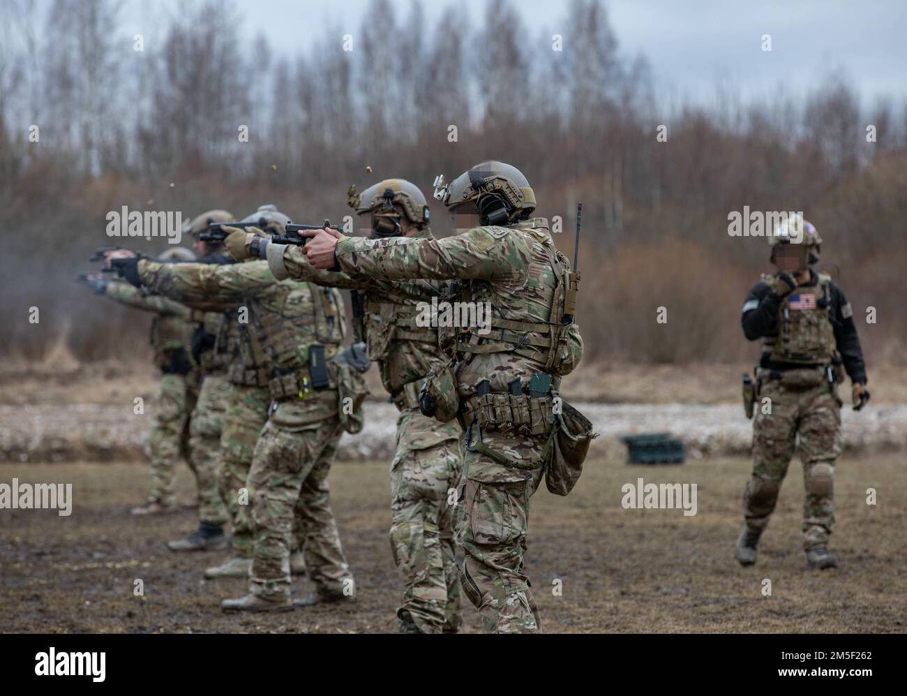 U.S. Special Forces conduct a timed range exercise where they fire in unison on the sound of a ...