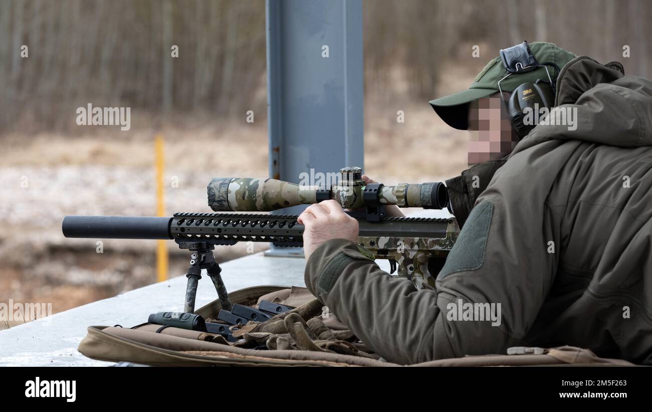 A Lithuanian Special Forces sniper conducts sniper range qualifications ...
