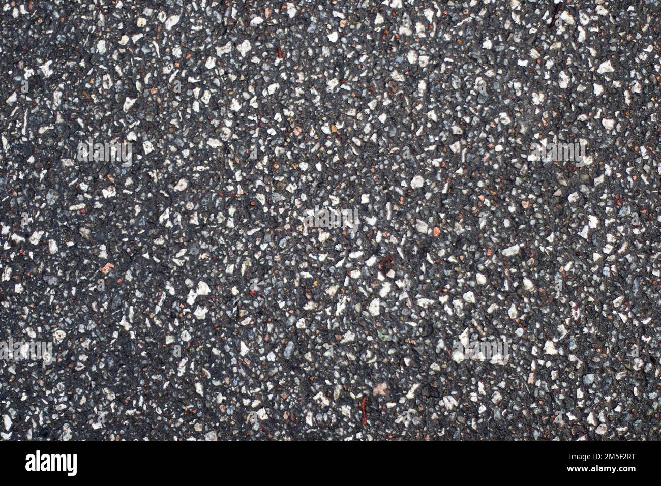 A close up of a speckled asphalt ground - perfect for wallpapers Stock ...