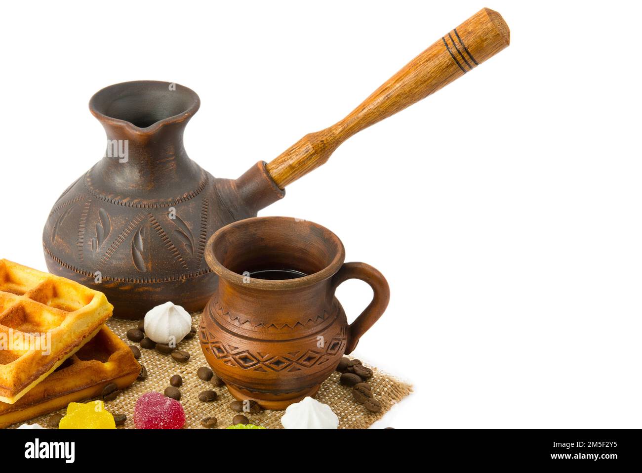 Clay coffee pot and mug isolated on white background. Free space for ...