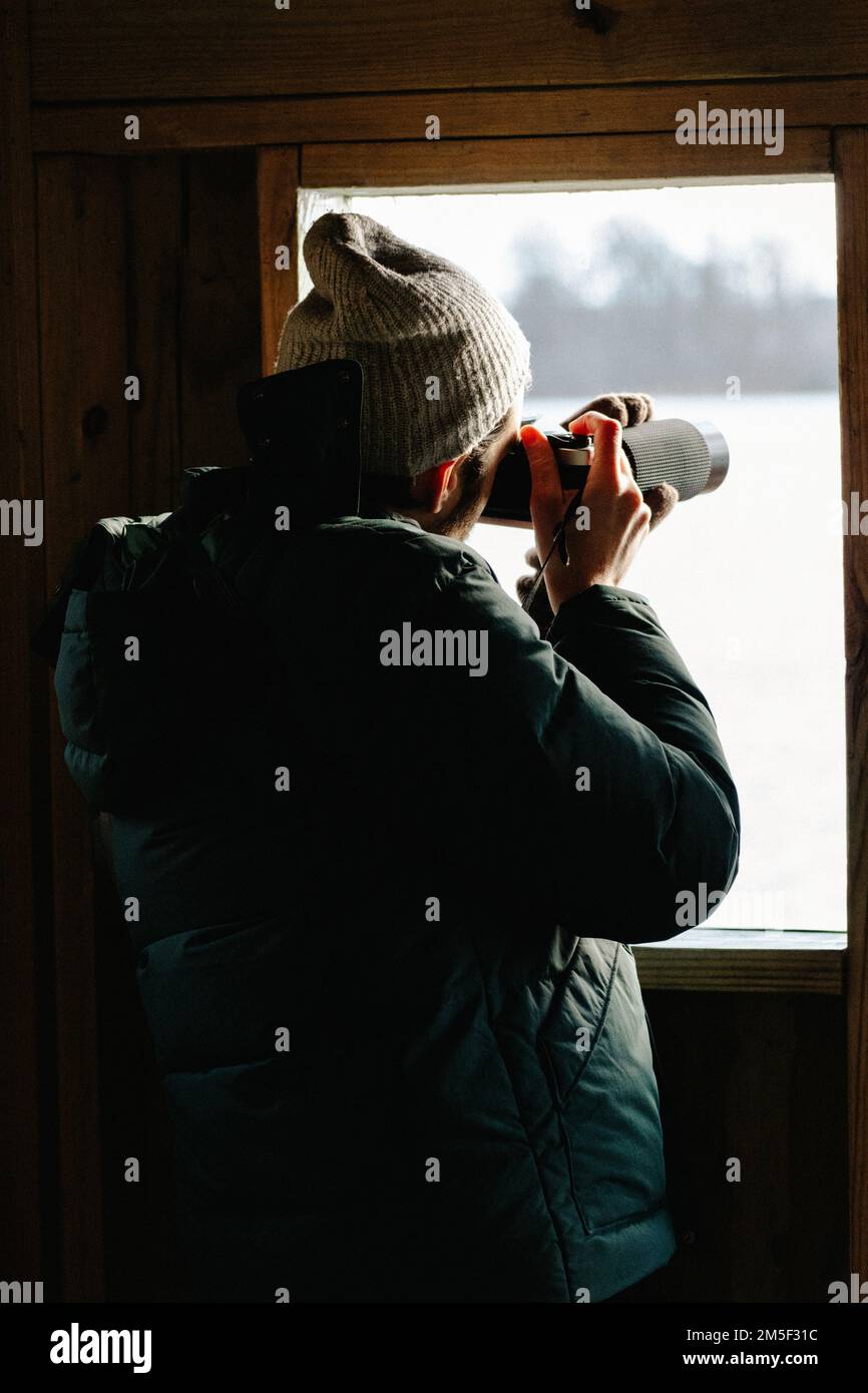 Male Photographer shooting Bird Photographs from the cover of Birding ...