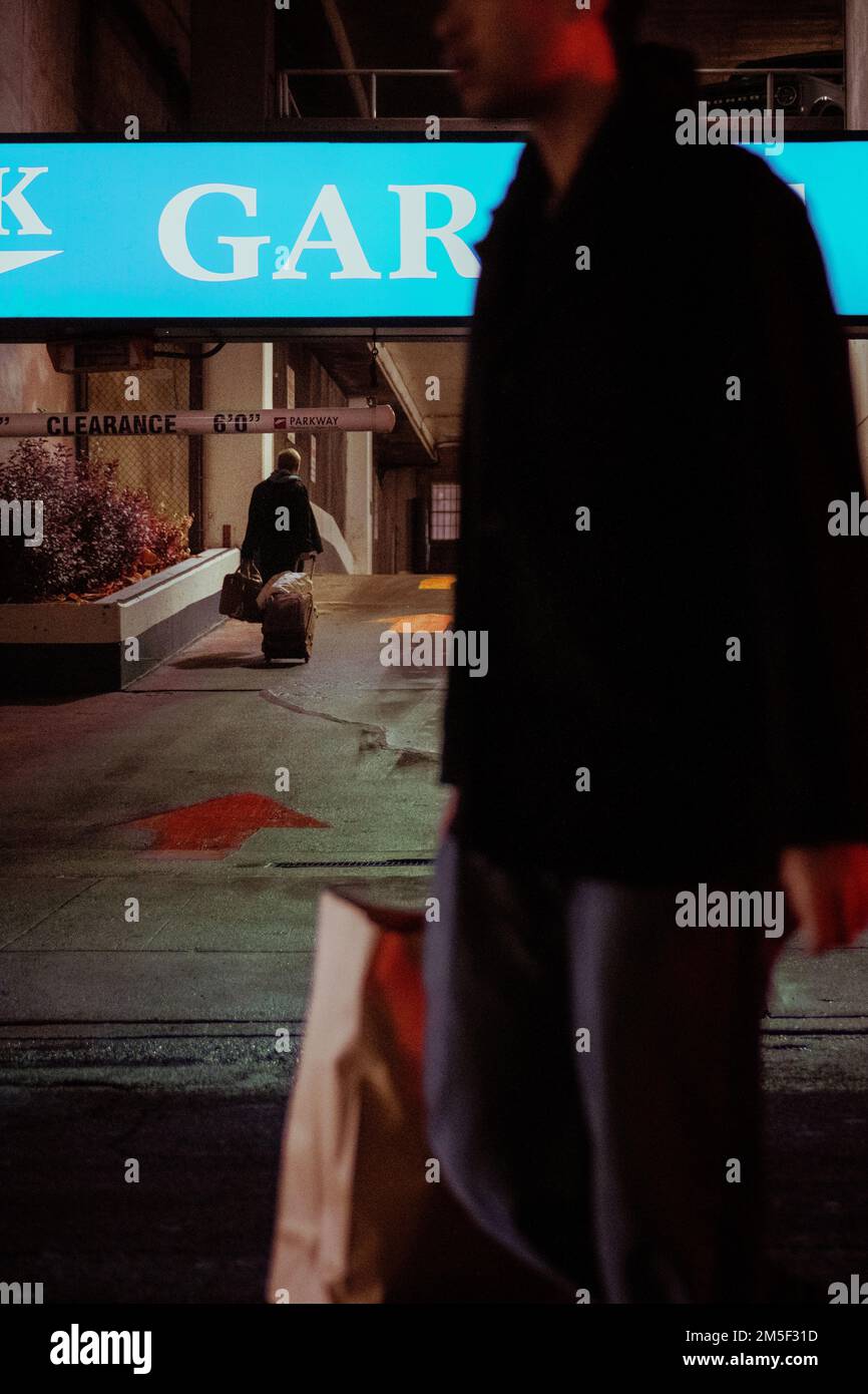 Anonymous people walking at night Stock Photo - Alamy