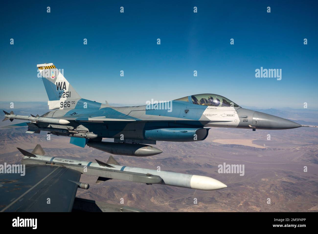 An F-16C Fighting Falcon flown by Maj. Douglas Mayo, pilot assigned to ...