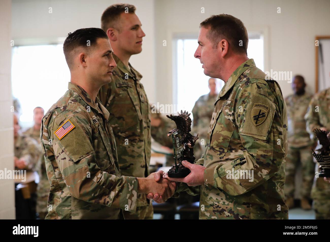 U.S Army Reserve Staff Sgt. Mitchell Hinton, left , a civil affairs ...