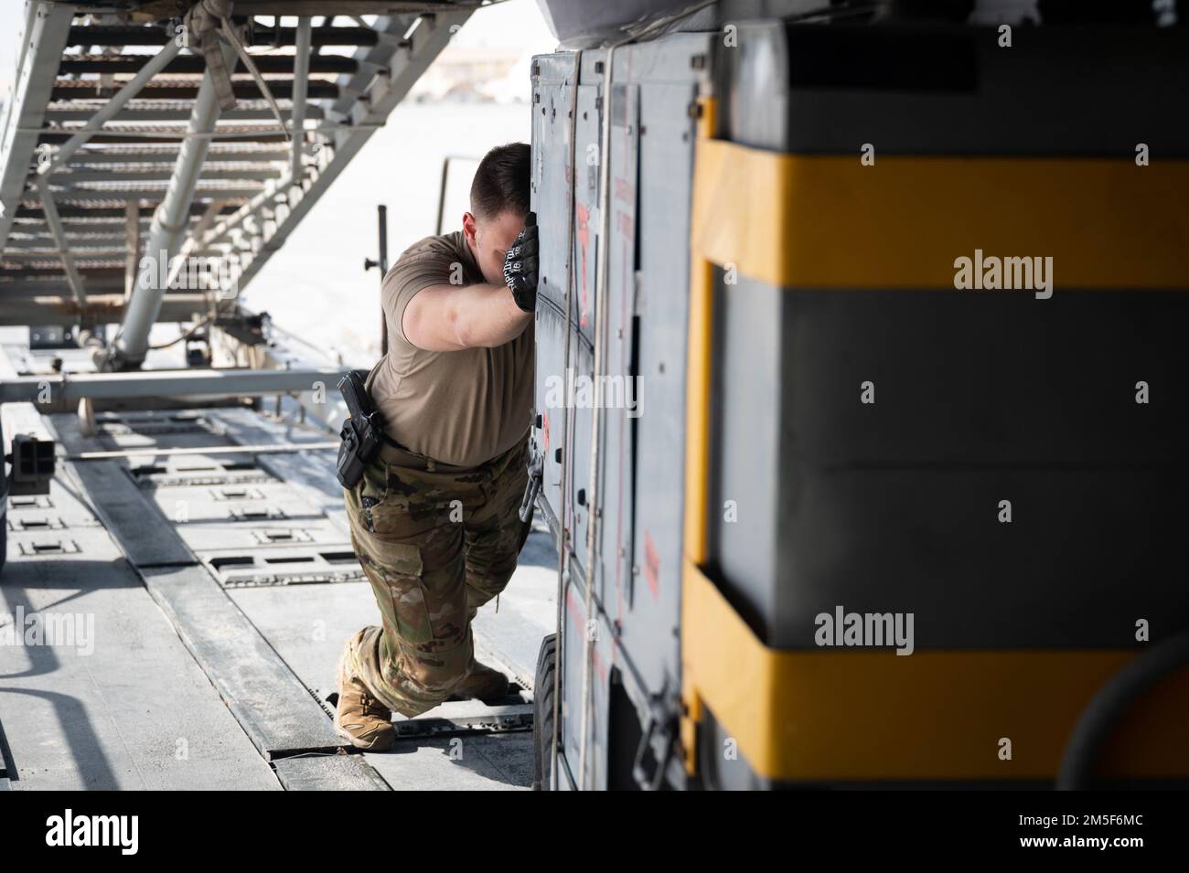A U.S. Air Force loadmaster assigned to the 816th Expeditionary Airlift ...