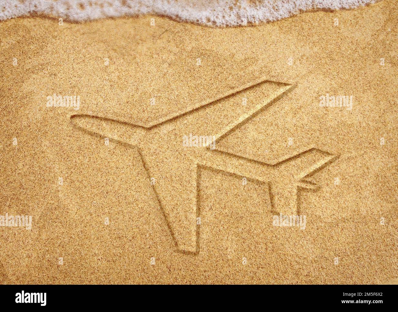 sandy beach with drawing of a Plane in the sand or symbol Stock Photo ...