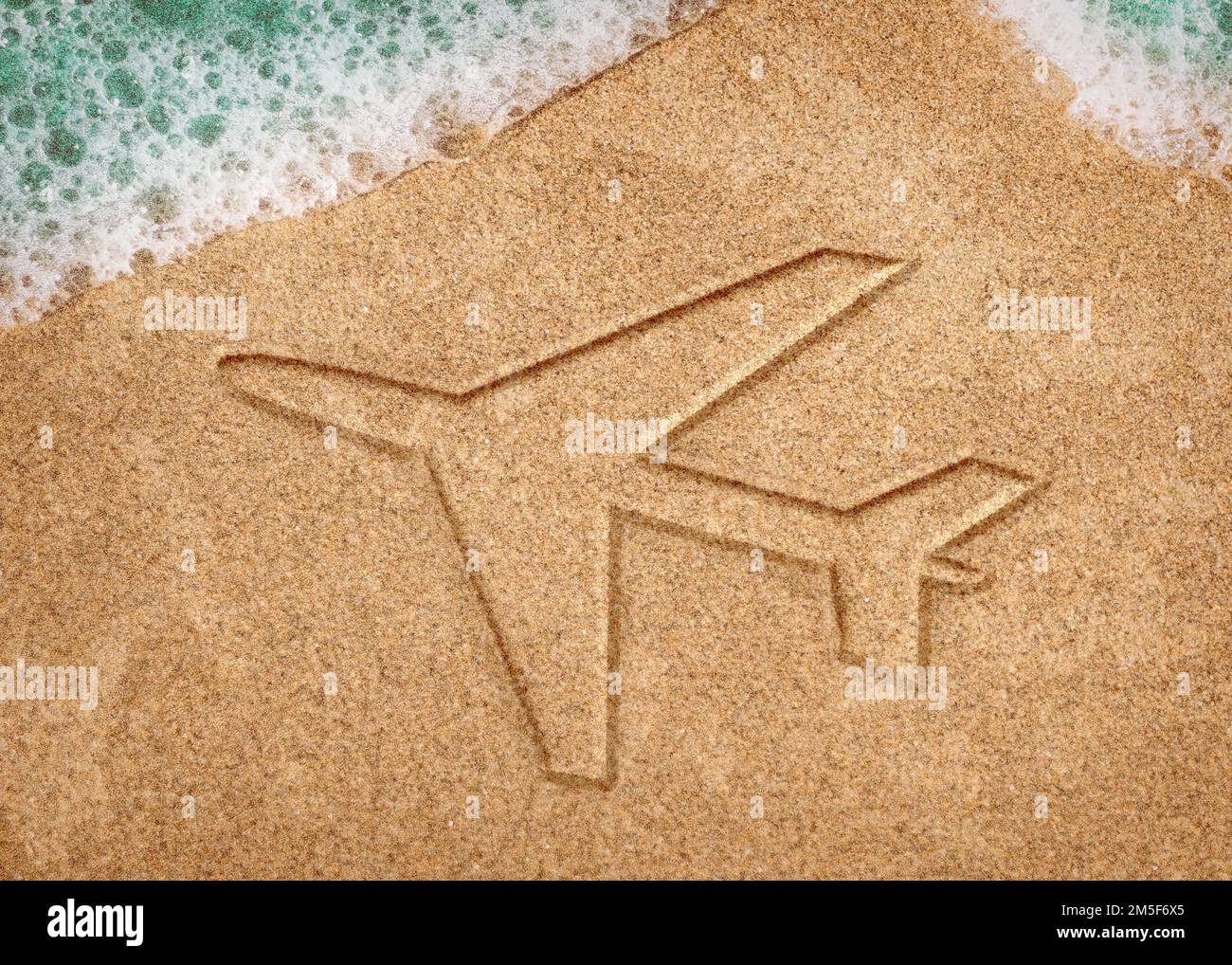 sandy beach with drawing of a Plane in the sand or symbol Stock Photo ...