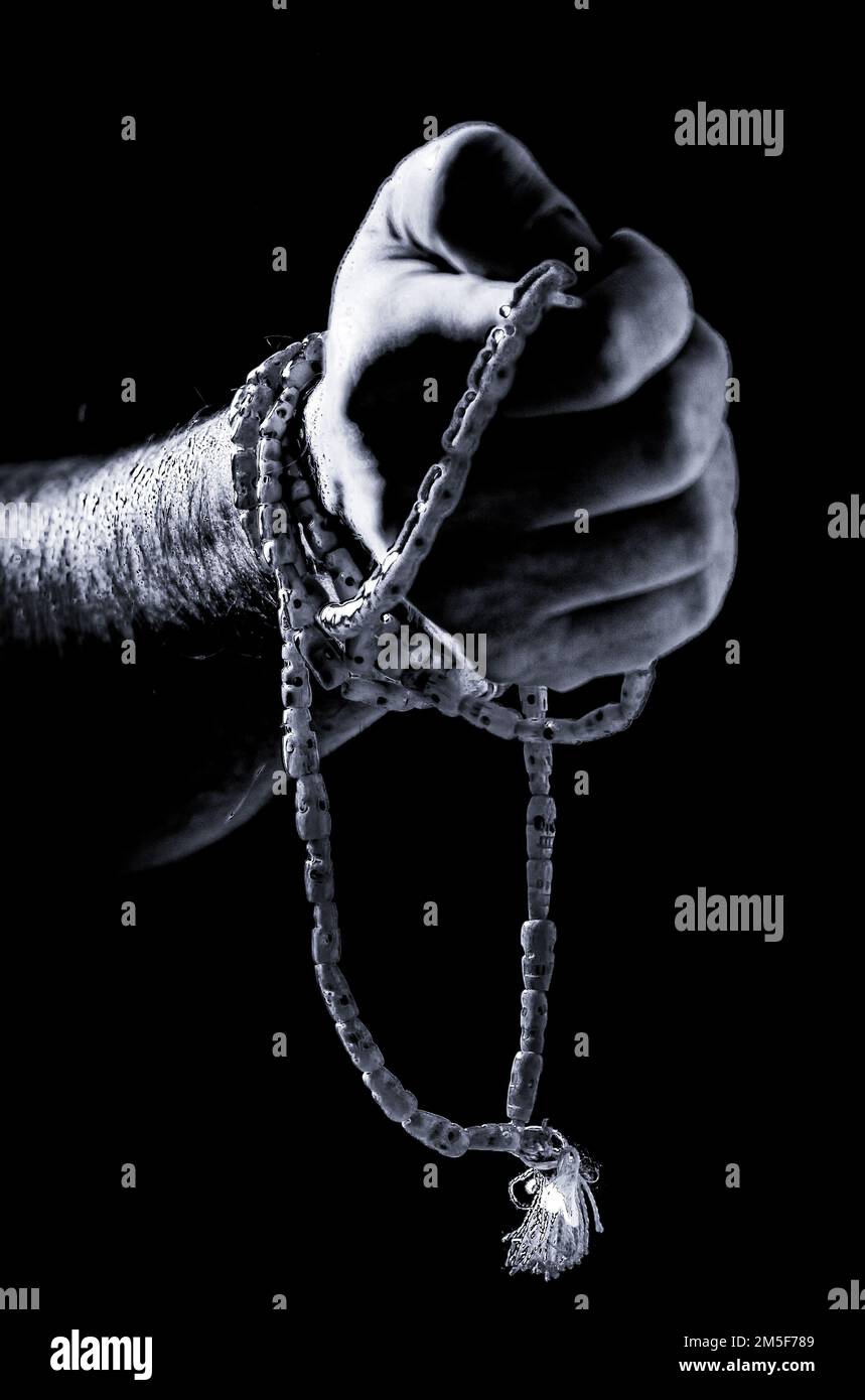 hand with prayer beads Stock Photo - Alamy
