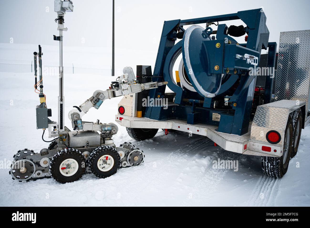An F6 robot assigned to the 354th Civil Engineering Squadron approaches ...