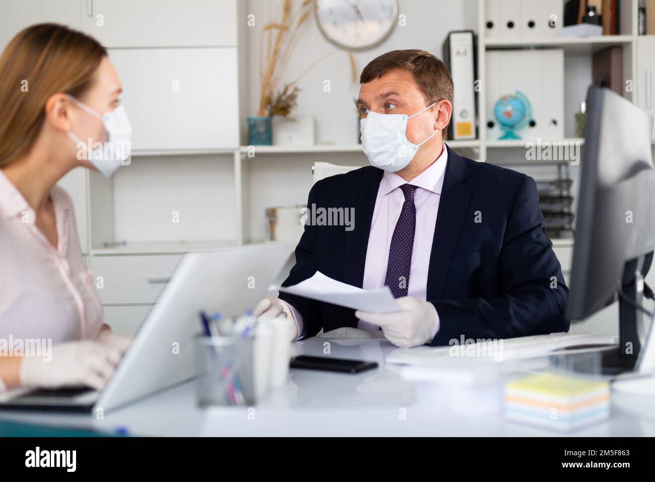 Use of personal protective equipment by office workers Stock Photo - Alamy