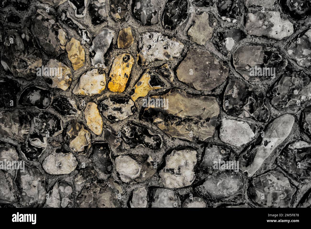 Hard light showing the strong textures in a stone wall and pointing ...