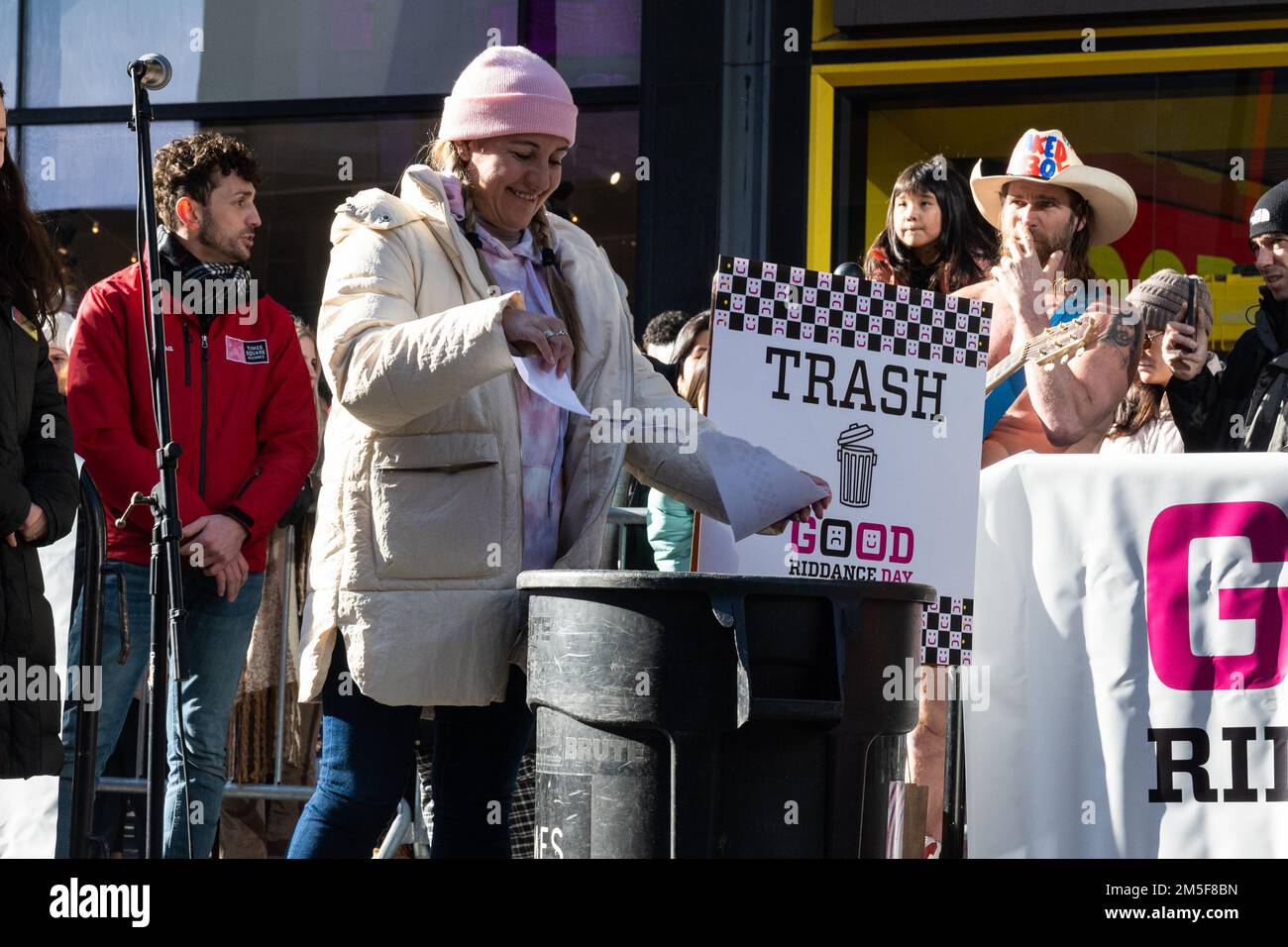 A woman trashes her bad memories and obstacles from 2022 at the annual ...