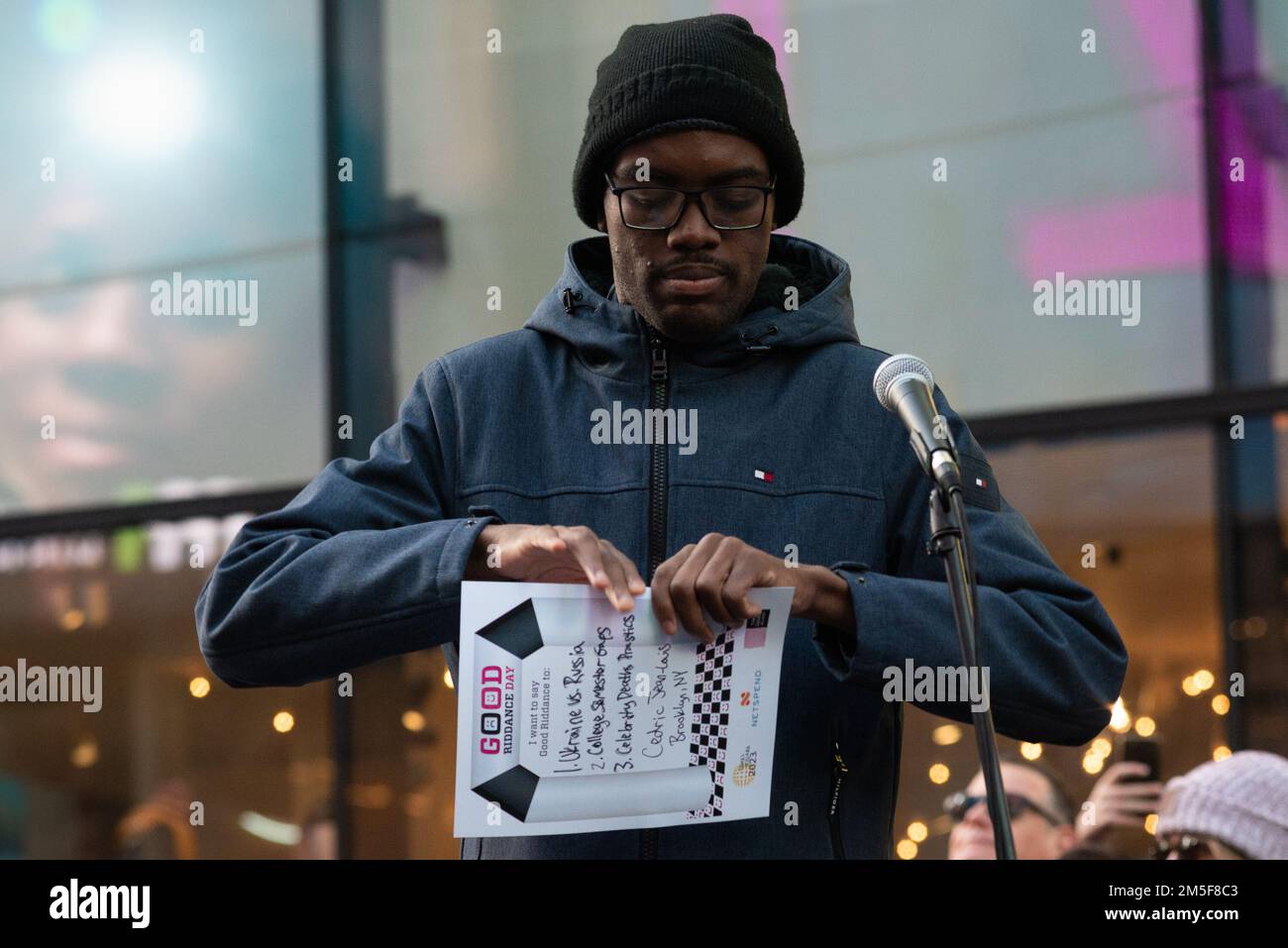 A man trashes bad memories and obstacles from 2022 at the annual "Good ...